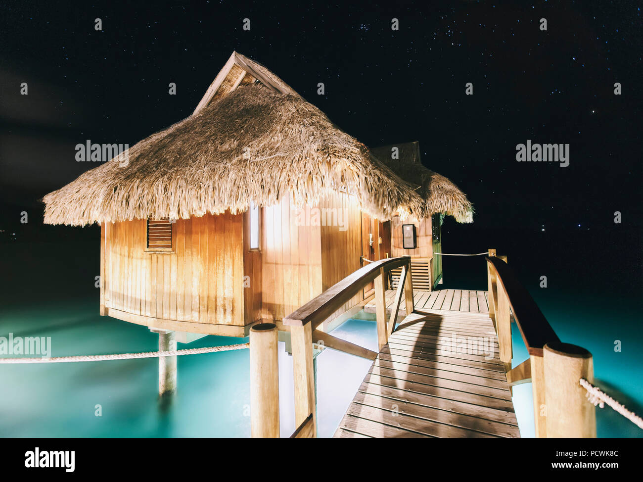 Bungalow night scene from Bora Bora, French Polynesia Stock Photo - Alamy
