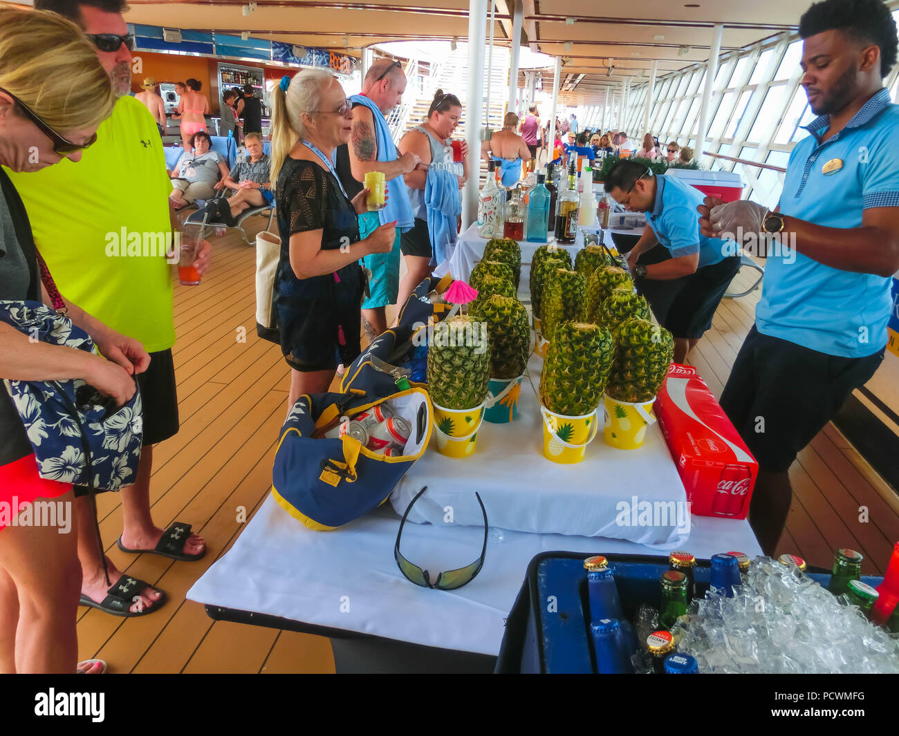 Cape Canaveral, USA - APRIL 29, 2018: The waiters with alcoholic drinks ...
