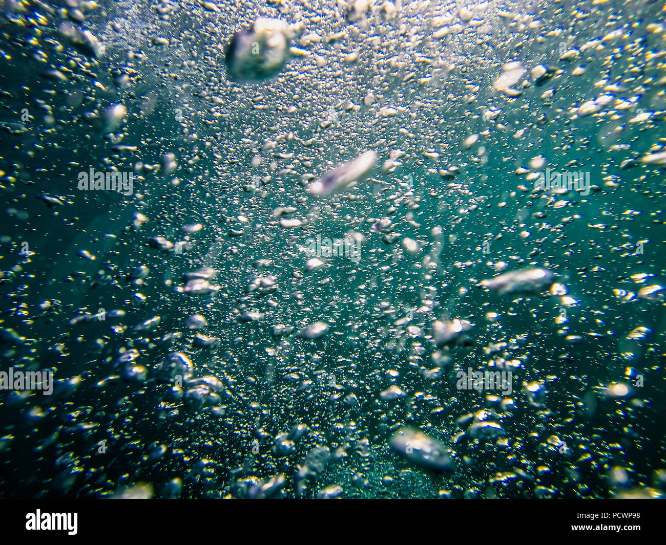 Air boobles in blue sea water. Maldives Stock Photo - Alamy