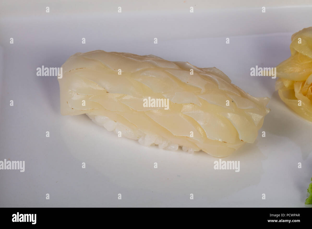 Japanese cold sushi with squid Stock Photo - Alamy