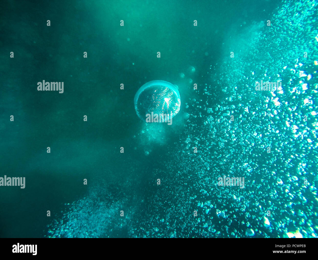 Air boobles in blue sea water. Maldives Stock Photo - Alamy