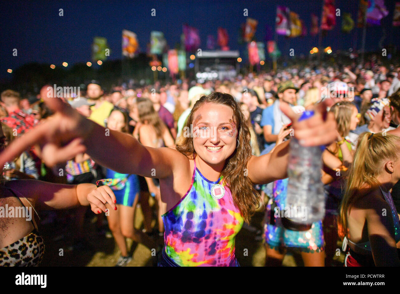 Revelers dance in the Temple Field at Bestival at the Lulworth Estate ...