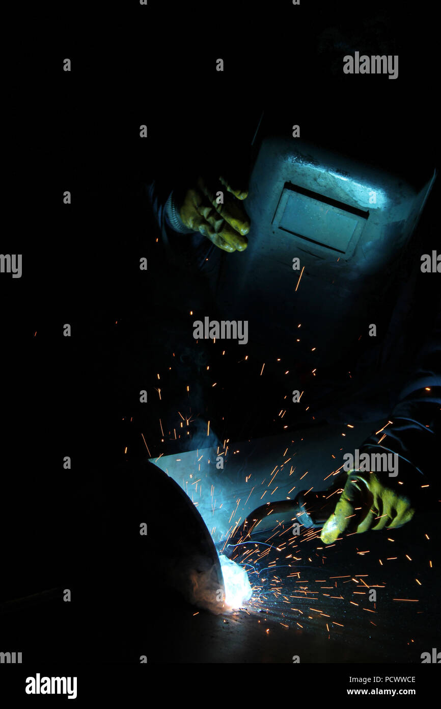 professional welding worker and sparks Stock Photo - Alamy