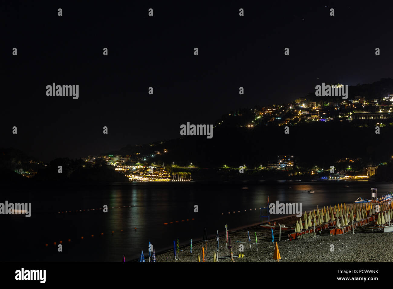 night view of the promontory of Taormina with its thousand lights Stock ...