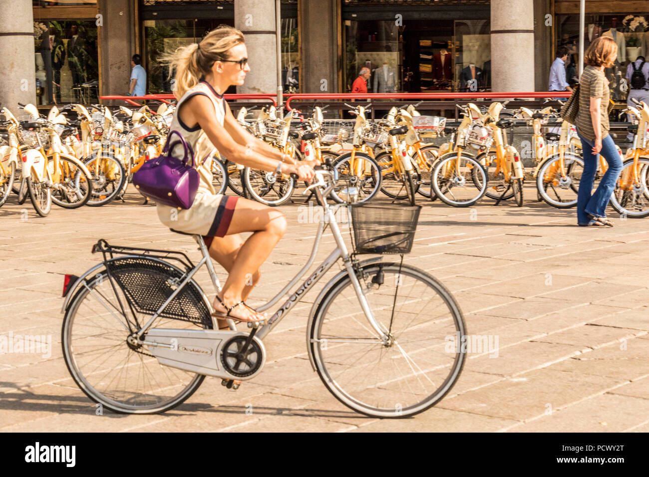 Cyclist in Pizza Del Duomo Milan Italy Stock Photo - Alamy