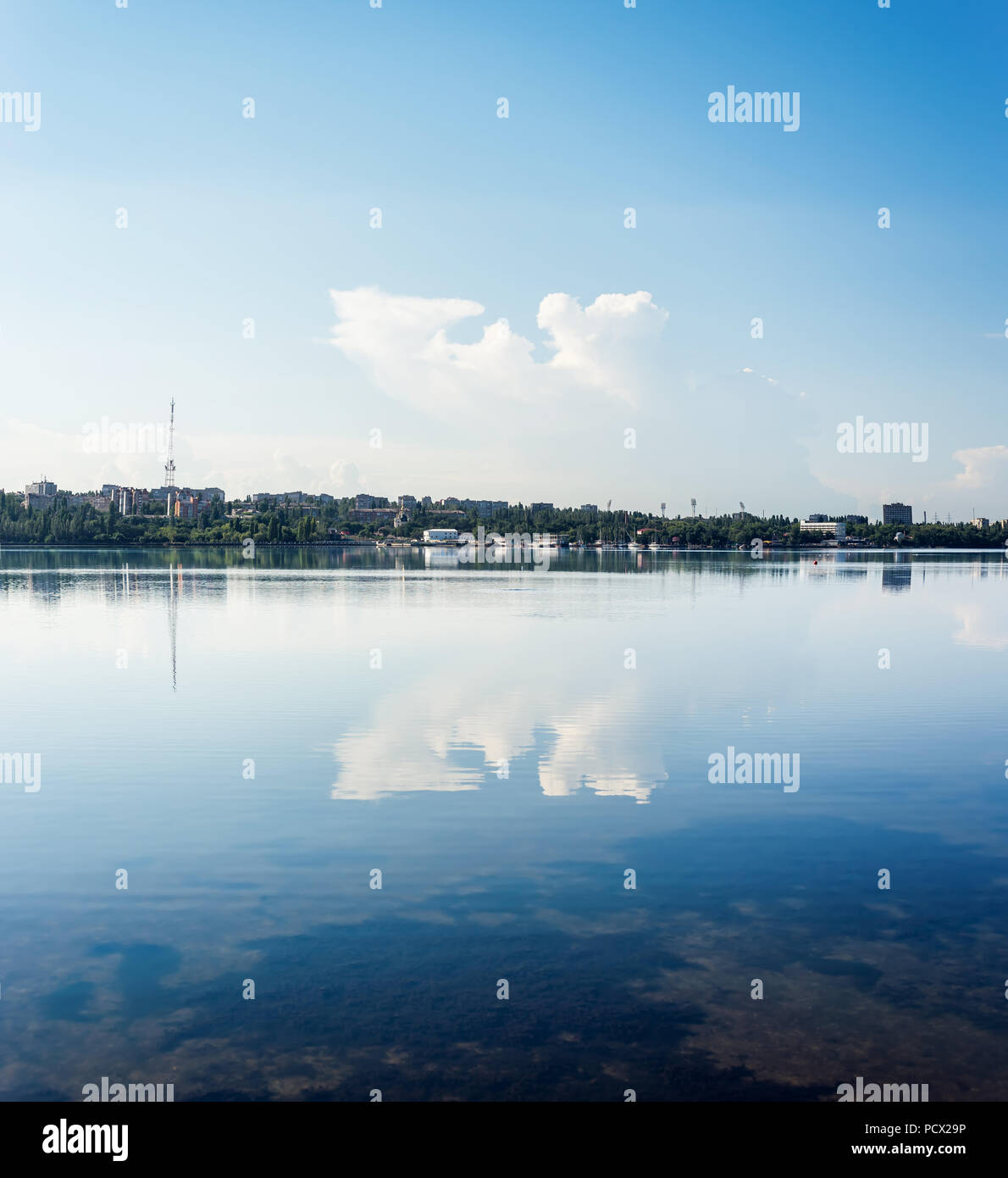 blue river and sky with clouds and reflections of it Stock Photo - Alamy