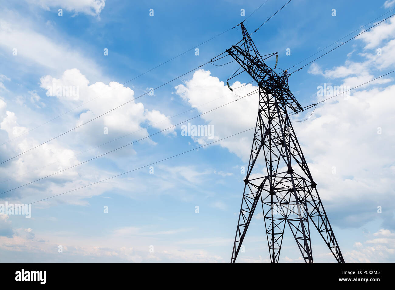 electricity power tower on blue sky background Stock Photo - Alamy