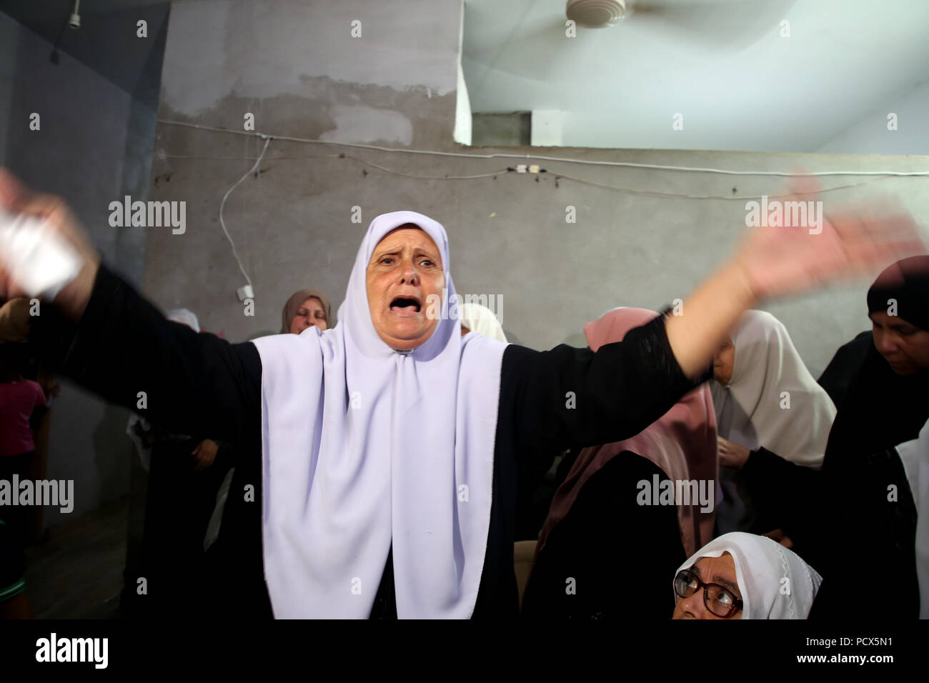 Nusairat, Gaza Strip, Palestinian Territory. 4th Aug, 2018. Relatives ...