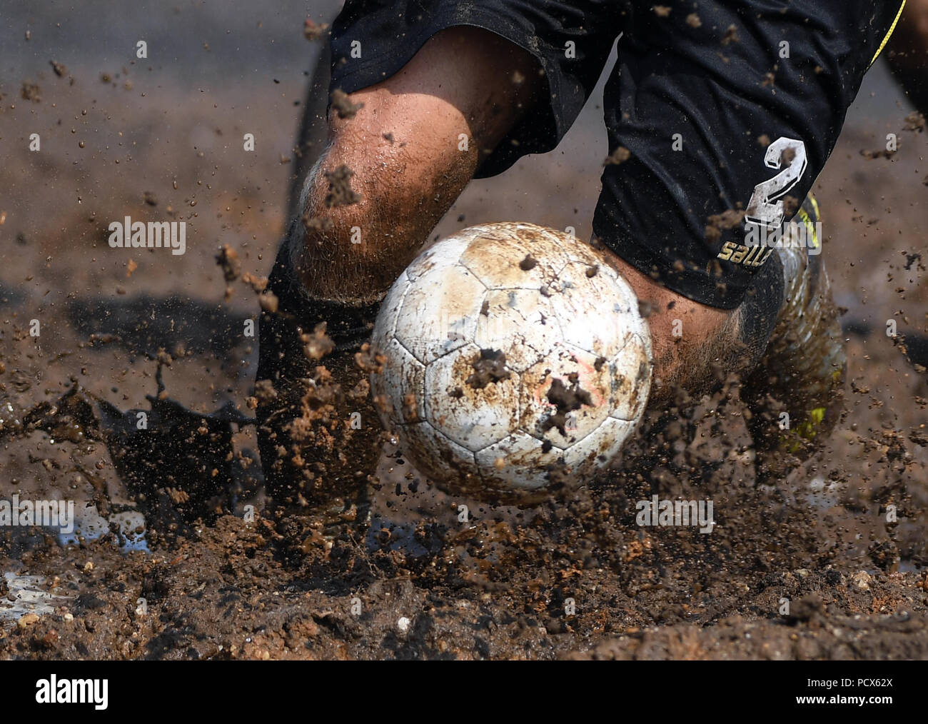 Woellnau, Germany. 04th Aug, 2018. Players of the German Mud Soccer ...