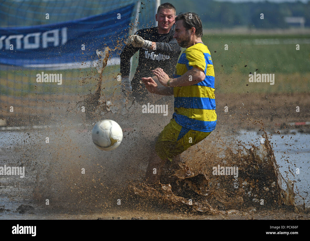 Woellnau, Germany. 04th Aug, 2018. Players of the German Mud Soccer ...