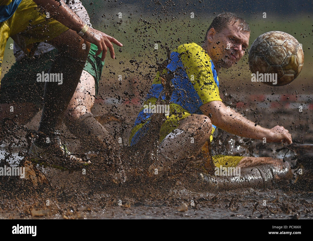 Woellnau, Germany. 04th Aug, 2018. Players of the German Mud Soccer ...