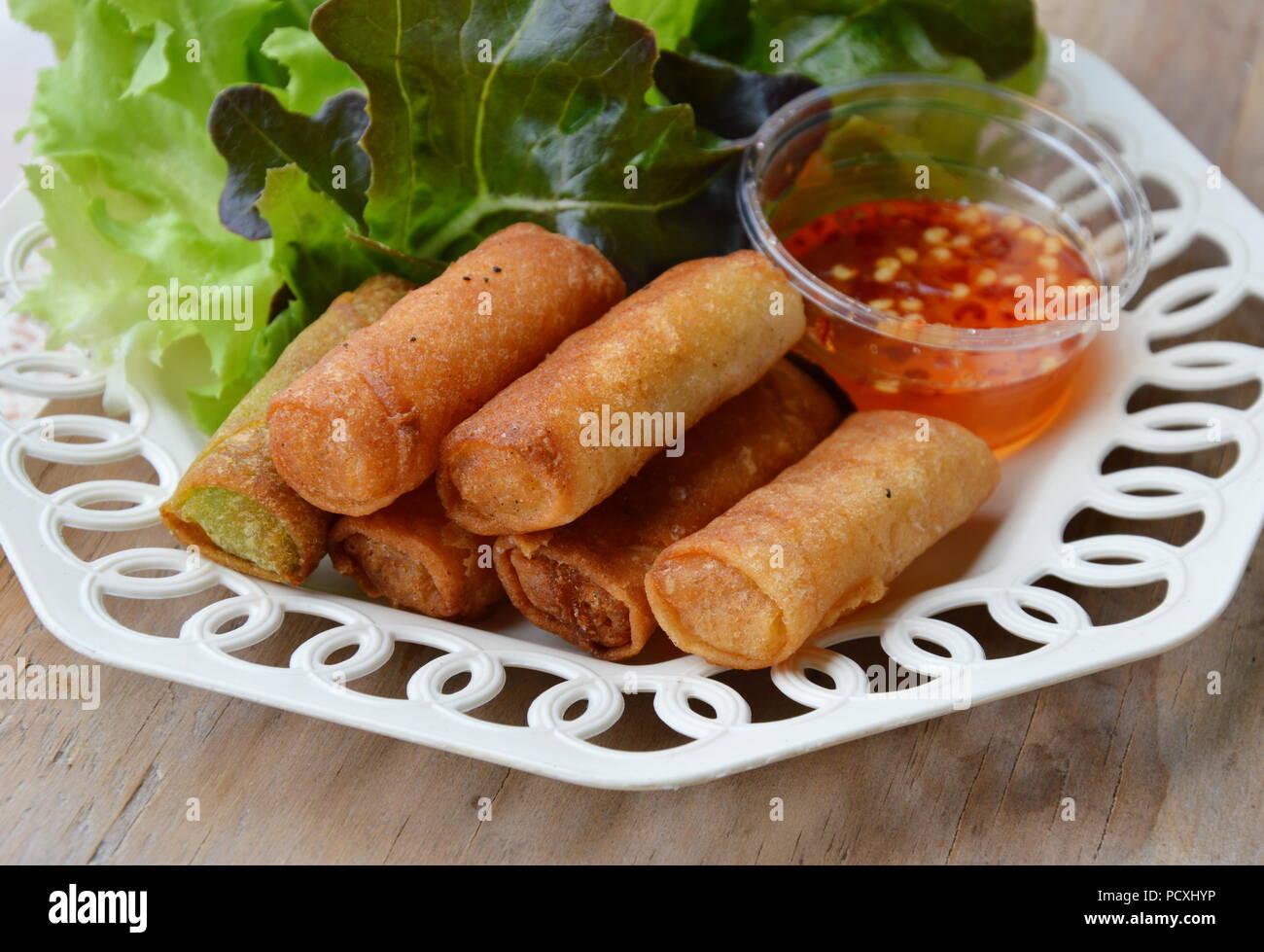 deep fried spring roll and sweet chili sauce on dish Stock Photo - Alamy