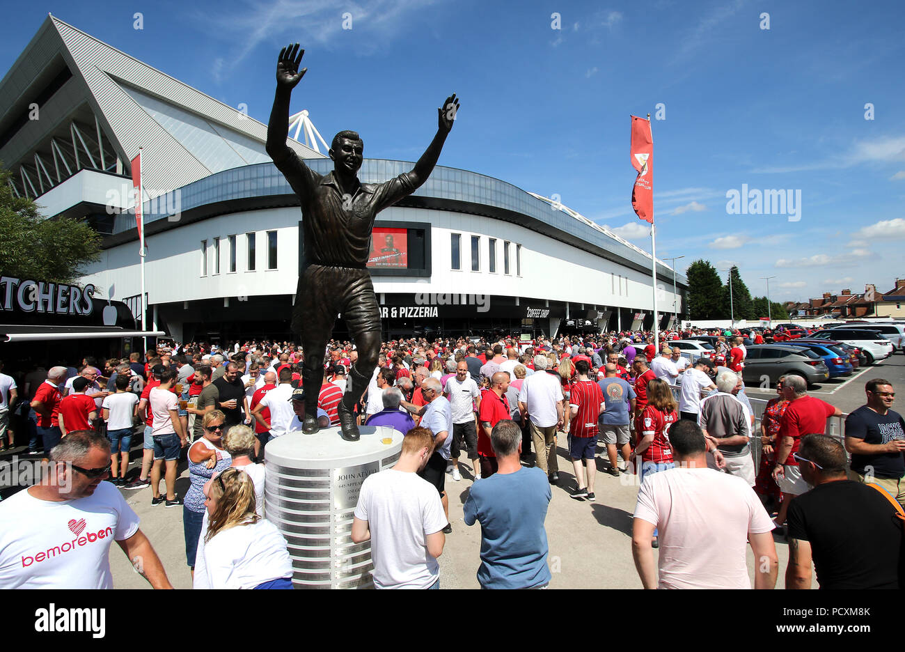 Fans walks past john atyeo statue hi-res stock photography and images ...