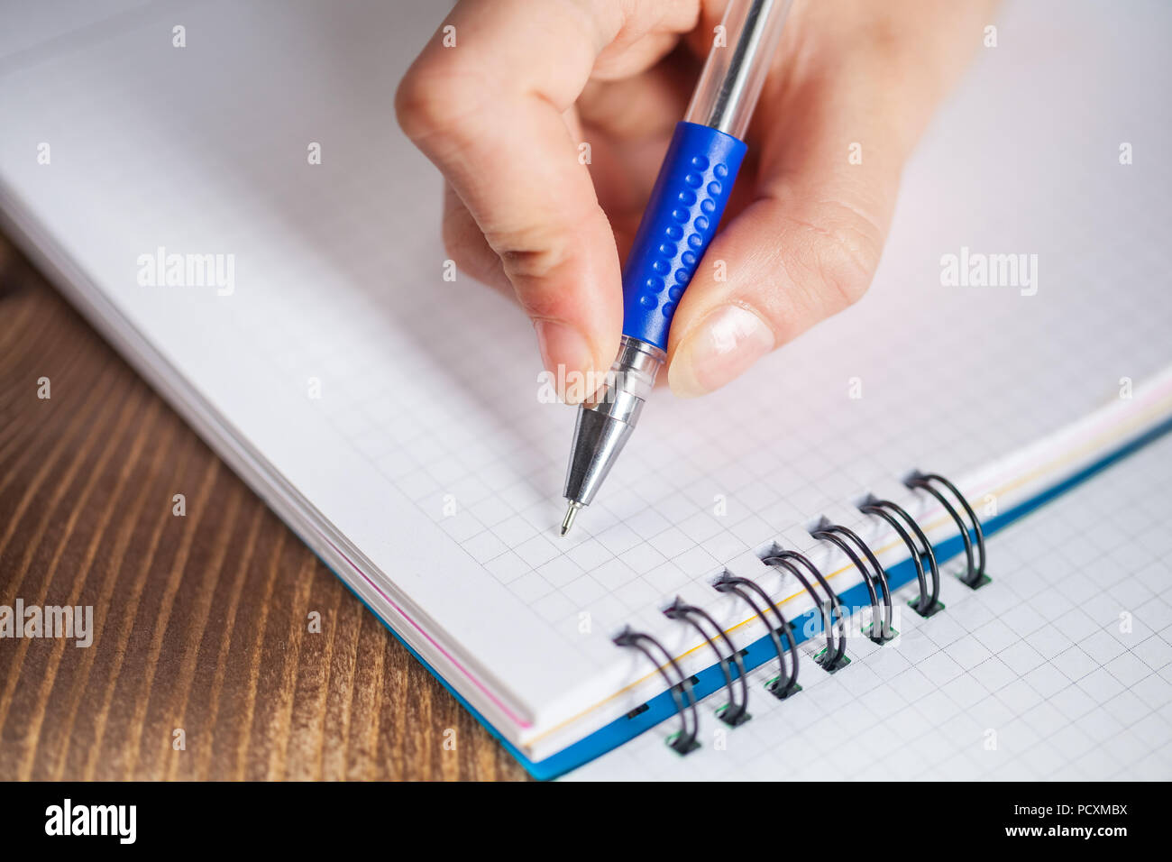 A close photo of a persons writing a letter with a pen Stock Photo - Alamy