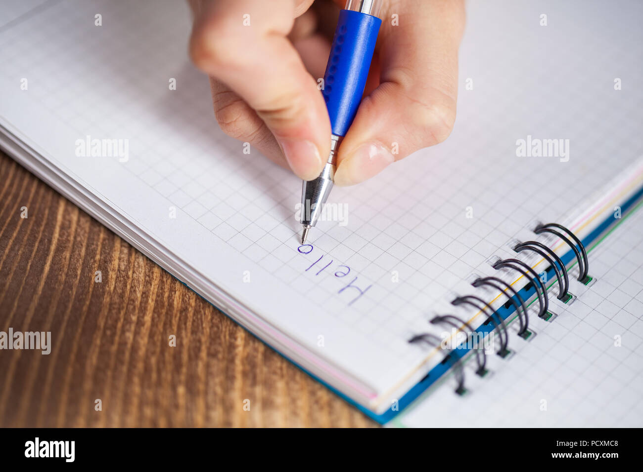A close photo of a persons writing a letter with a pen Stock Photo - Alamy
