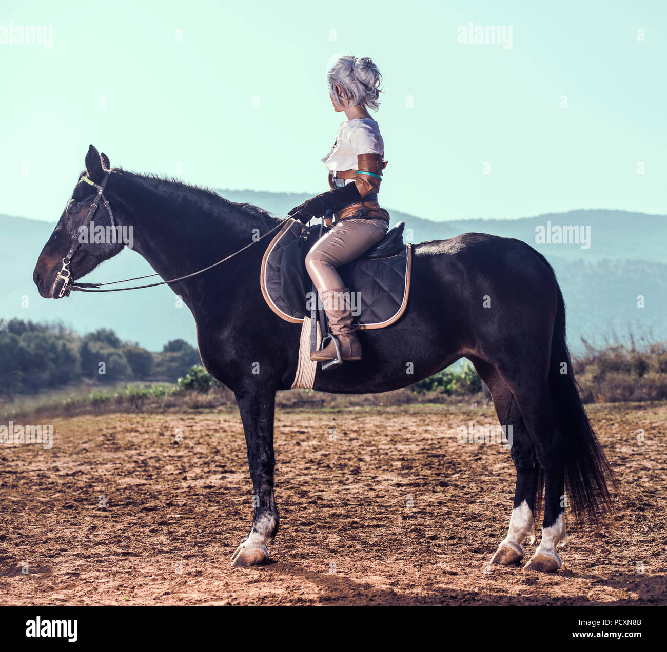 a girl dressed as an elf on a horse Stock Photo - Alamy