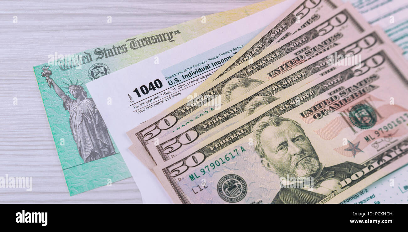 Money and refund check US Federal tax 1040 income tax form Stock Photo ...