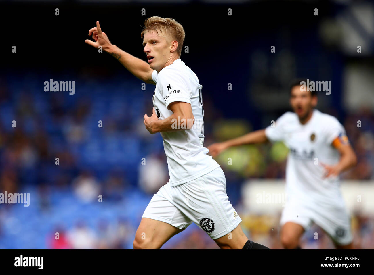 Valencia's Daniel Wass celebrates scoring his side's third goal of the ...