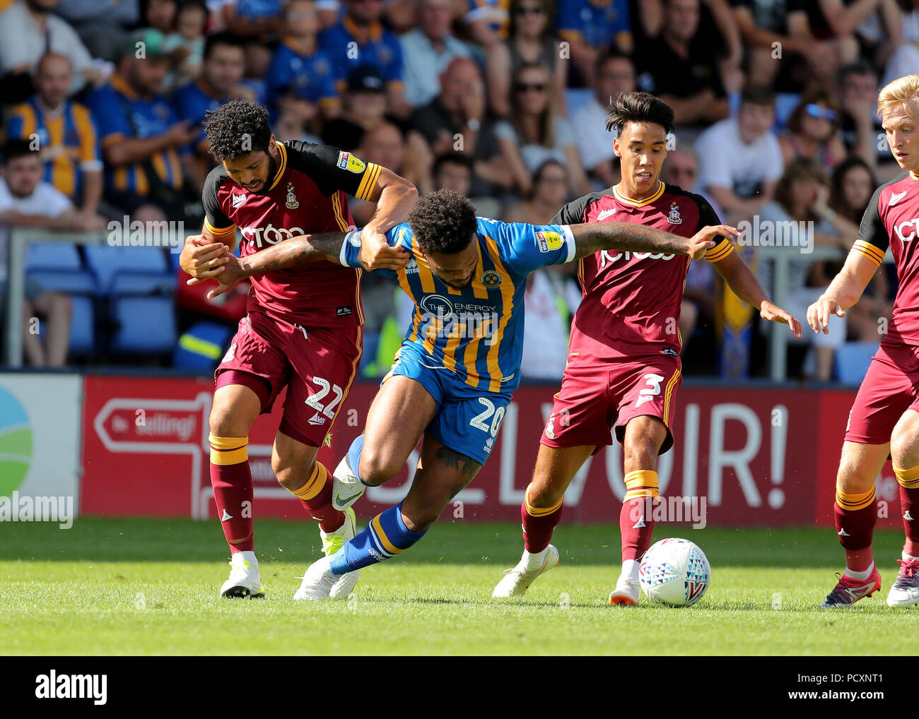 Shrewsbury Town's Aaron Amadi-Holloway and Bradford City's Nathaniel ...