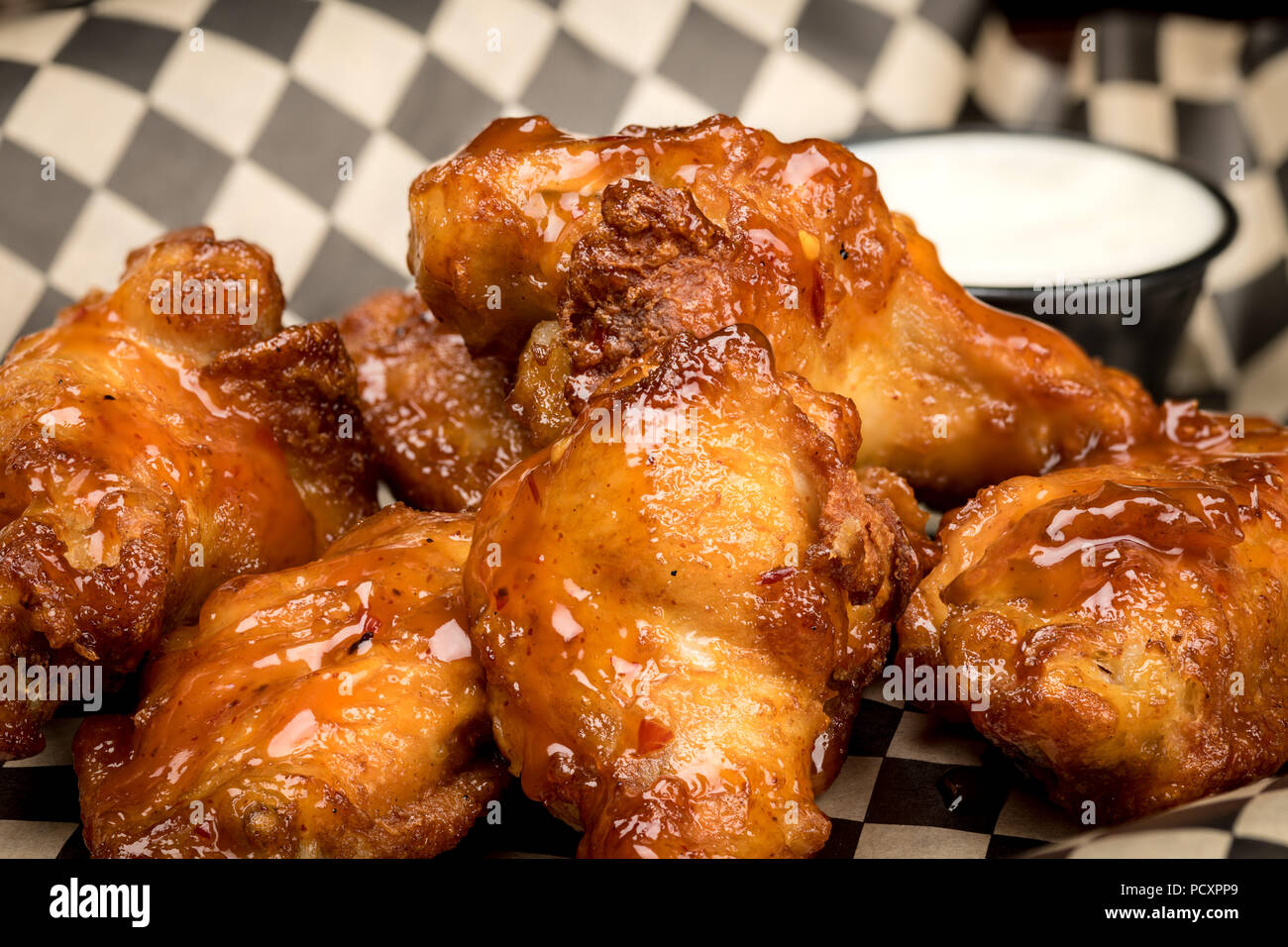Many wings in a lunch basket ready to serve Stock Photo - Alamy