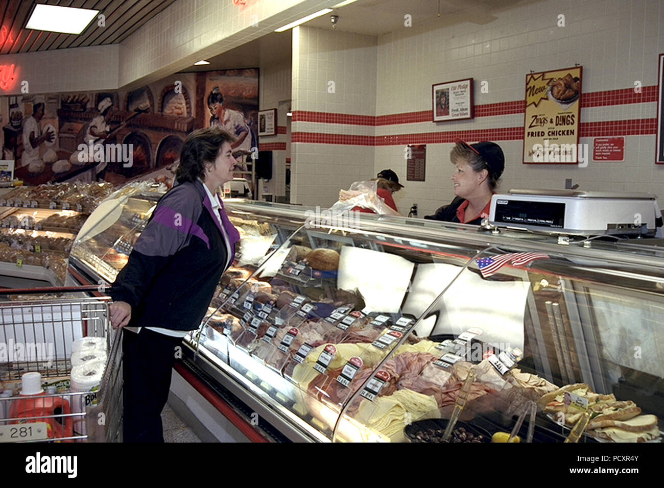June 2000 - Shopper At Deli Section In Grocery Store Stock Photo - Alamy