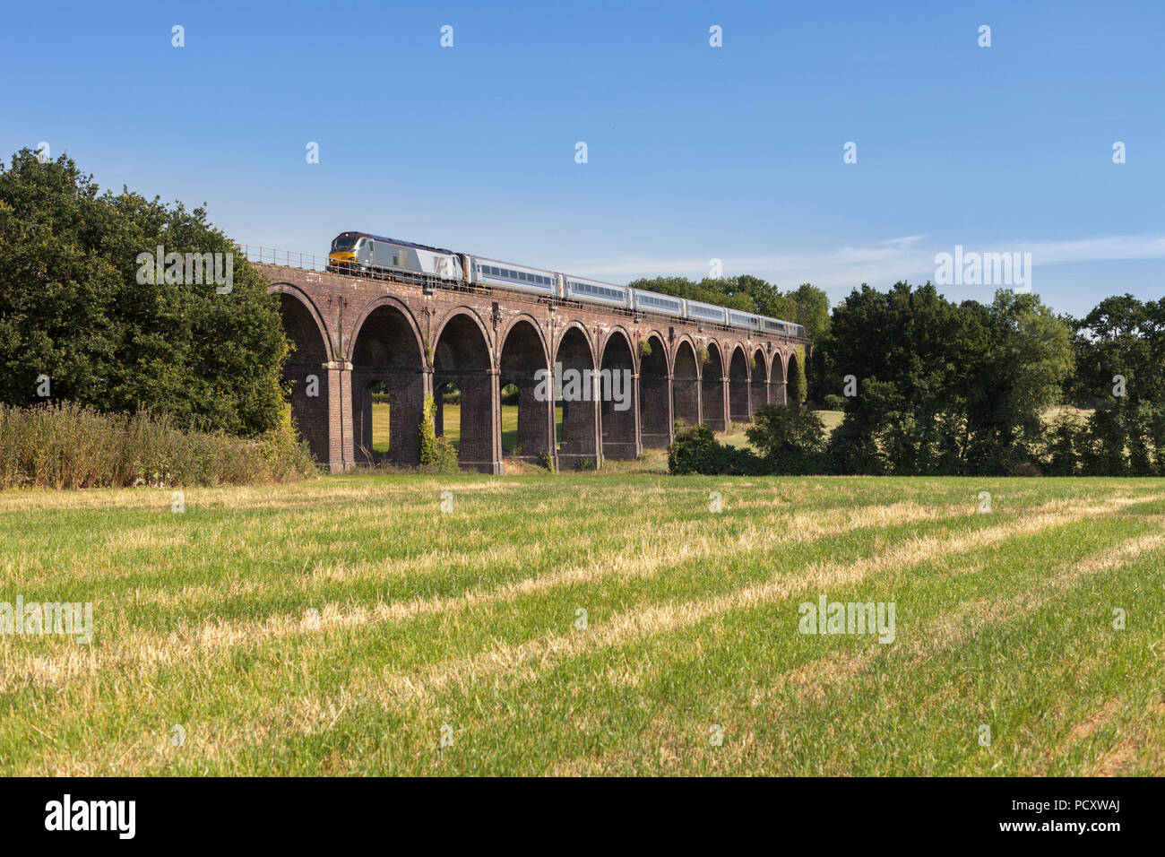 A Chiltern railways class 68 locomotive crossing Saunderton Viaduct ...
