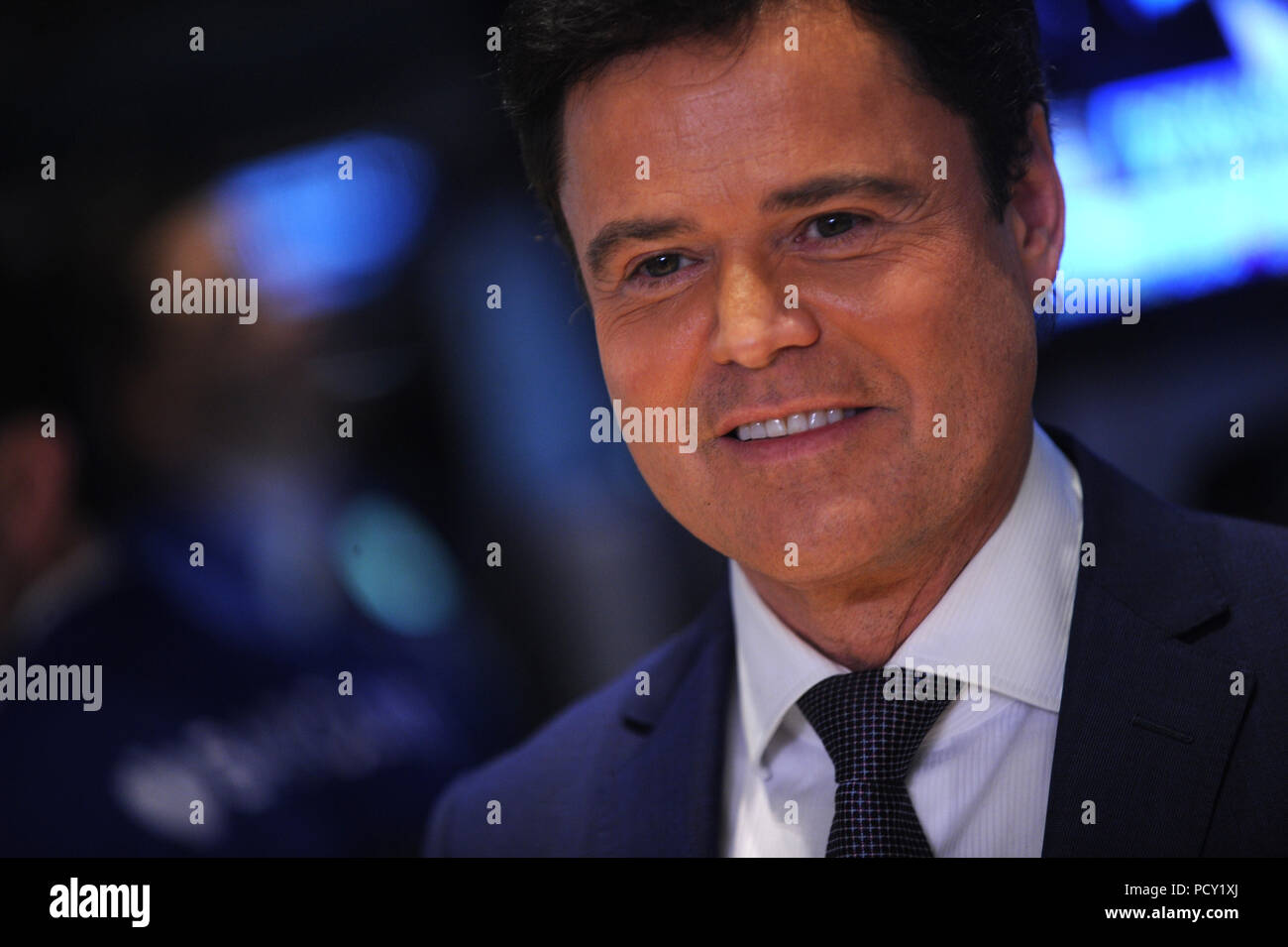 NEW YORK, NY - JANUARY 13: Singer/actor Donny Osmond (L) rings The NYSE ...