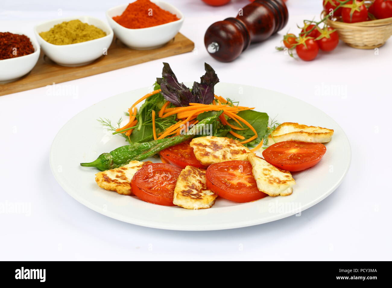 Grilled Halloumi cheese and tomato Stock Photo - Alamy