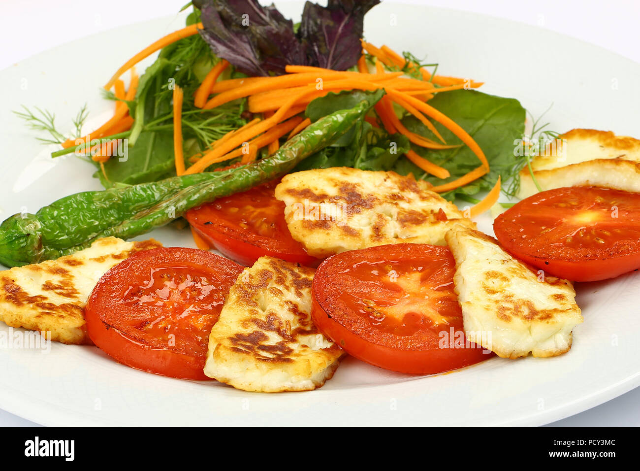 Grilled Halloumi cheese and tomato Stock Photo - Alamy