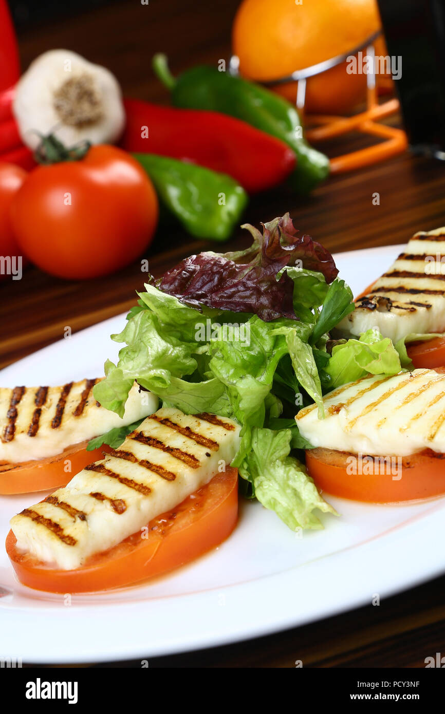 Grilled Halloumi cheese and tomato Stock Photo - Alamy