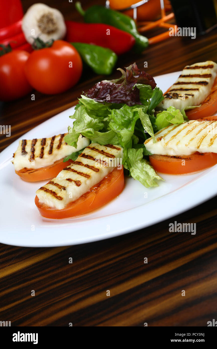 Grilled Halloumi cheese and tomato Stock Photo - Alamy