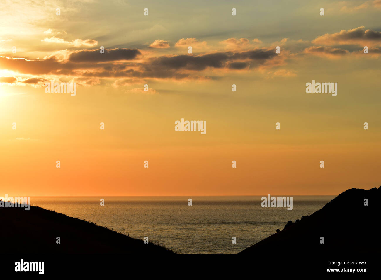 Sunset over sea, Cornwall Stock Photo - Alamy