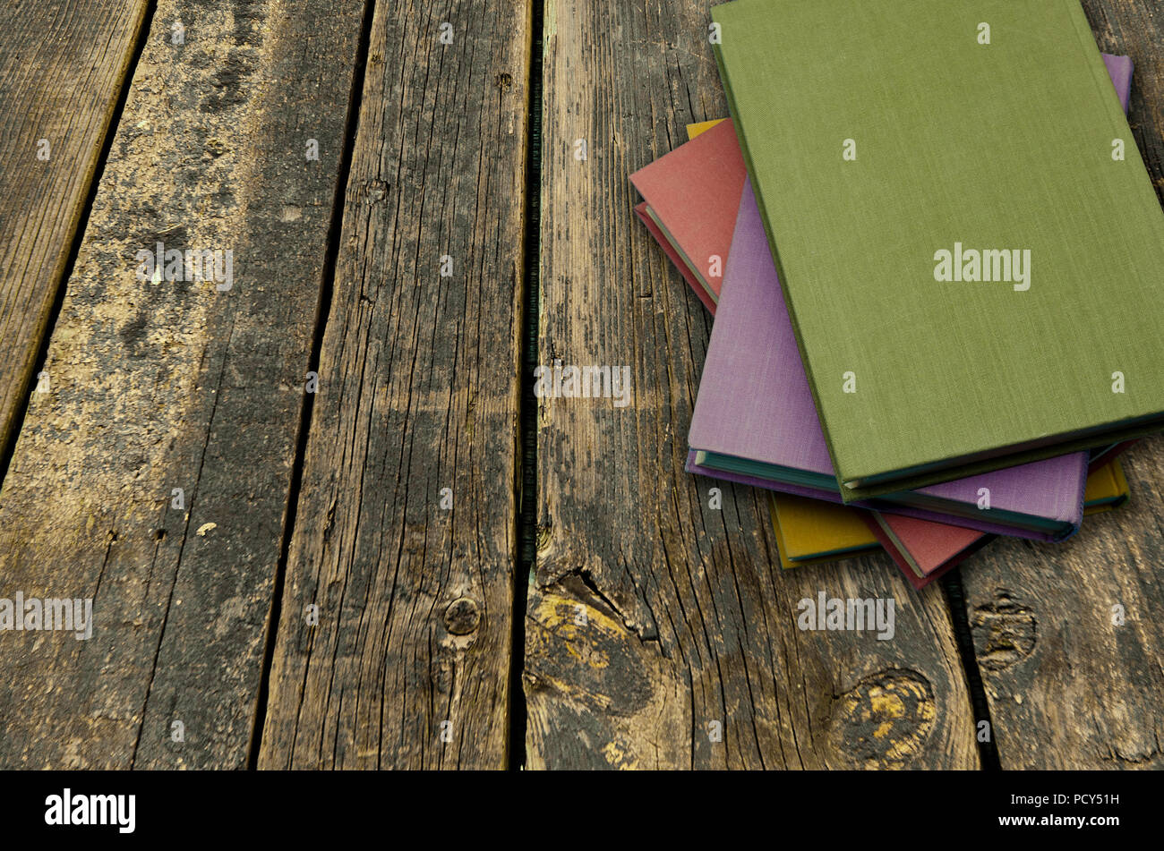books on grunge wooden table background. Retro style filtered photo ...