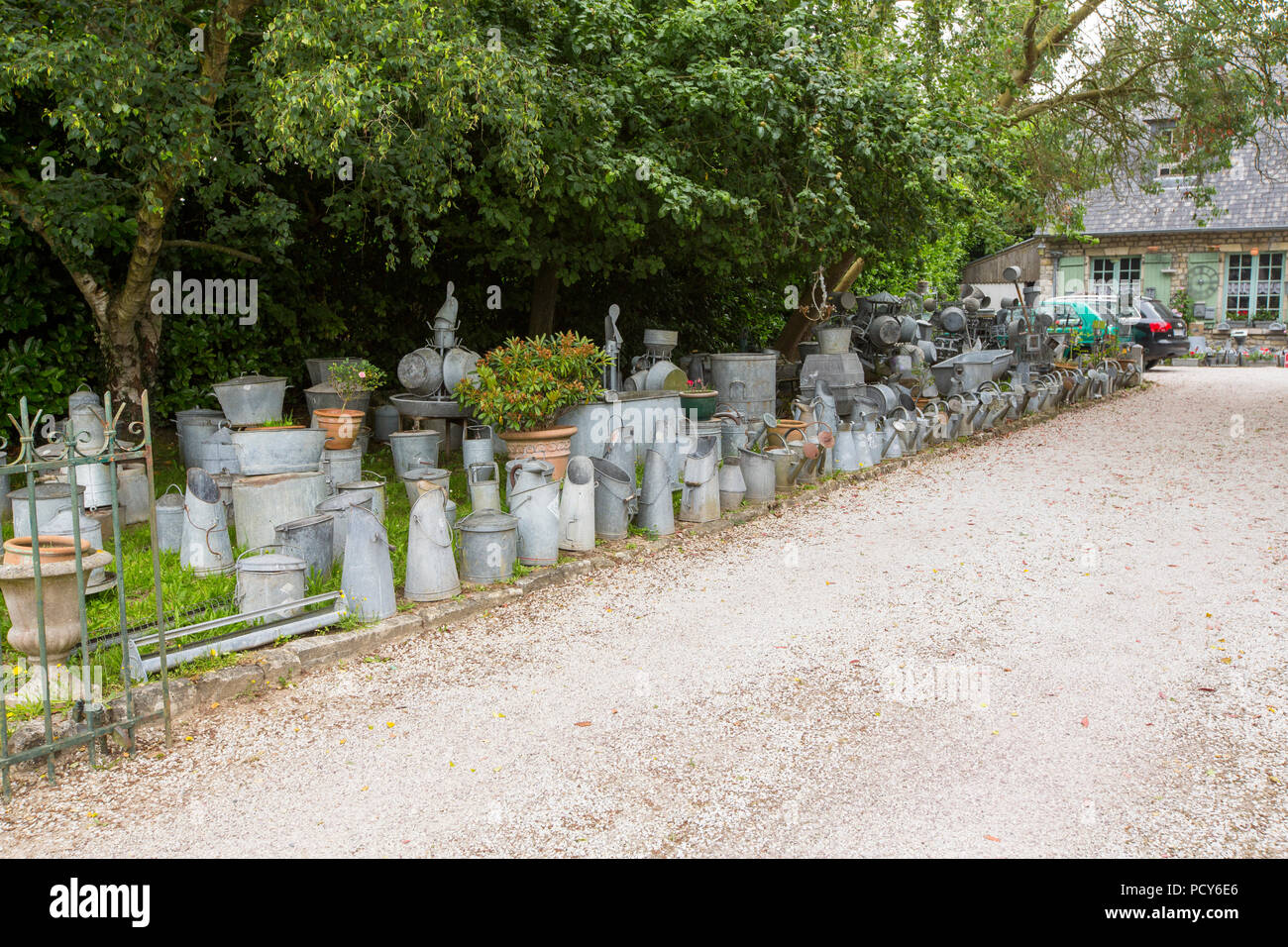 A collection of galvanised objects in a garden of a house in Saint Mere ...