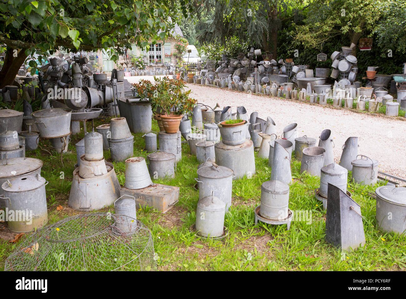 A collection of galvanised objects in a garden of a house in Saint Mere ...
