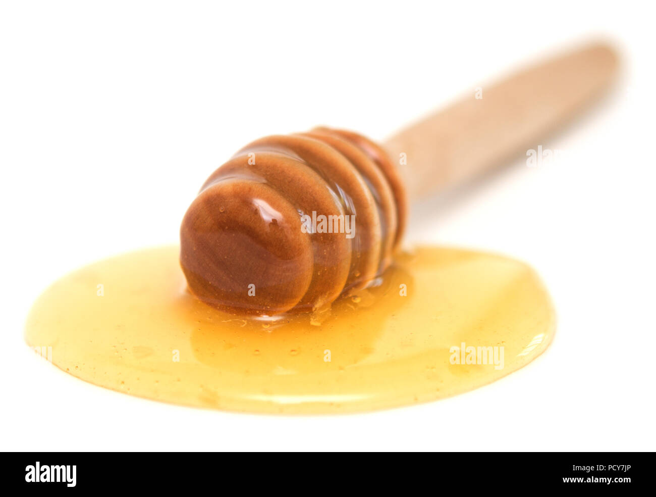 Wooden honey dipper isolated on white background Stock Photo - Alamy