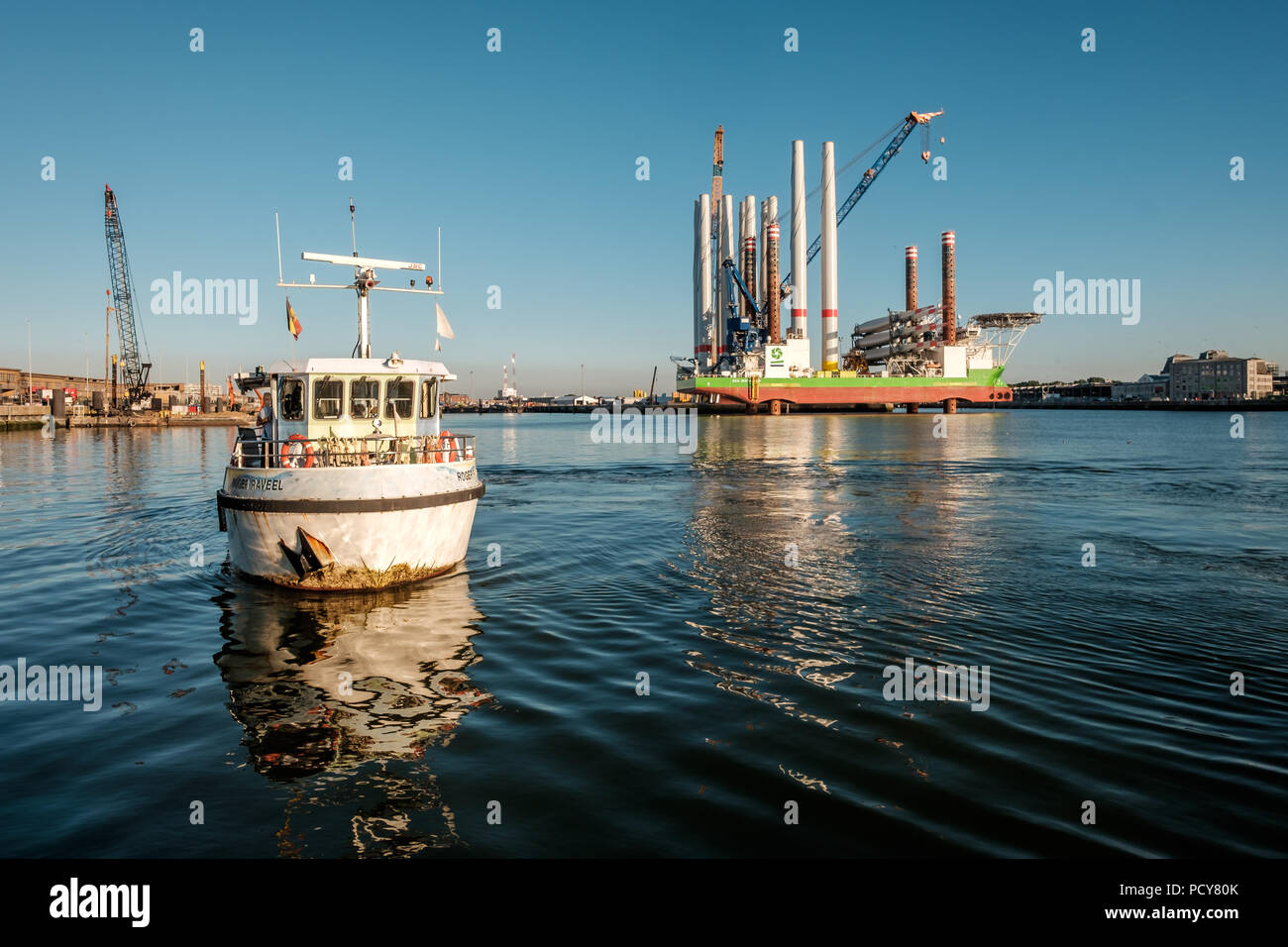 Passenger ferry in the port of Ostend with in the background the mighty ...