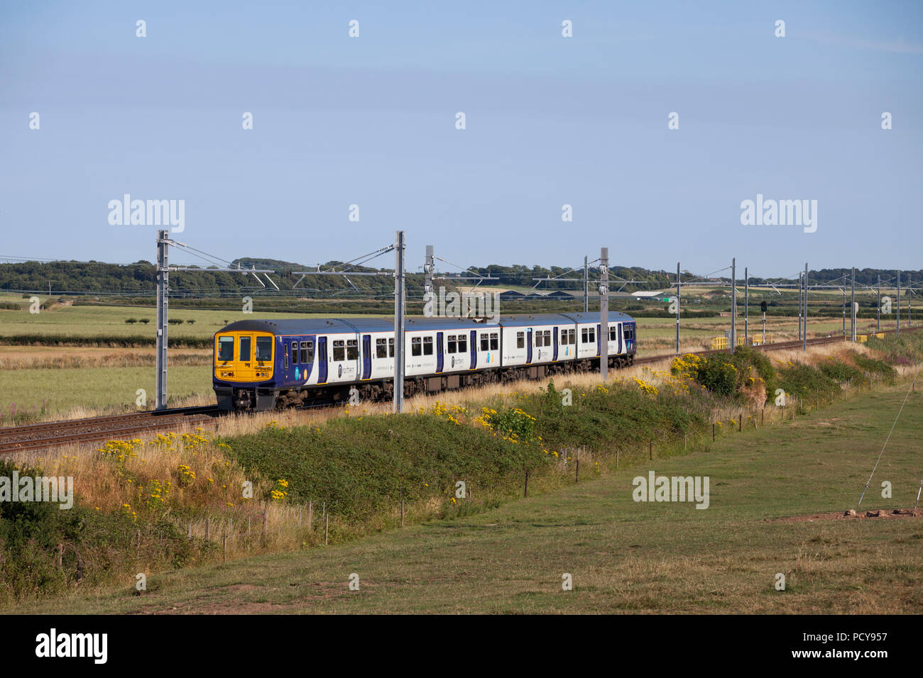 A Northern rail class 319 electric train passing Hardhorn on the railway line to Blackpool North ...