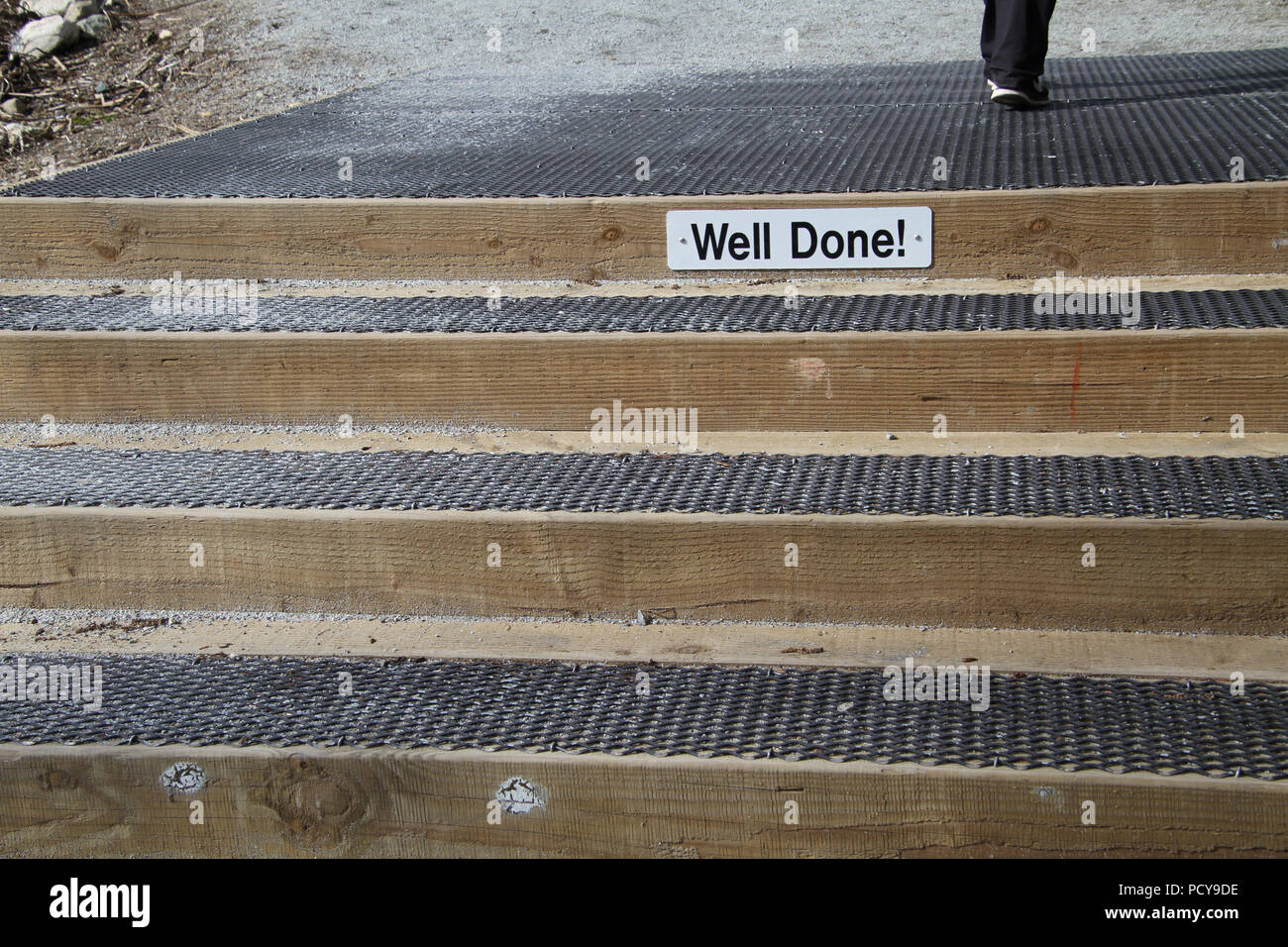 Well done sign on a flight of stairs to acknowledge your accomplishment ...