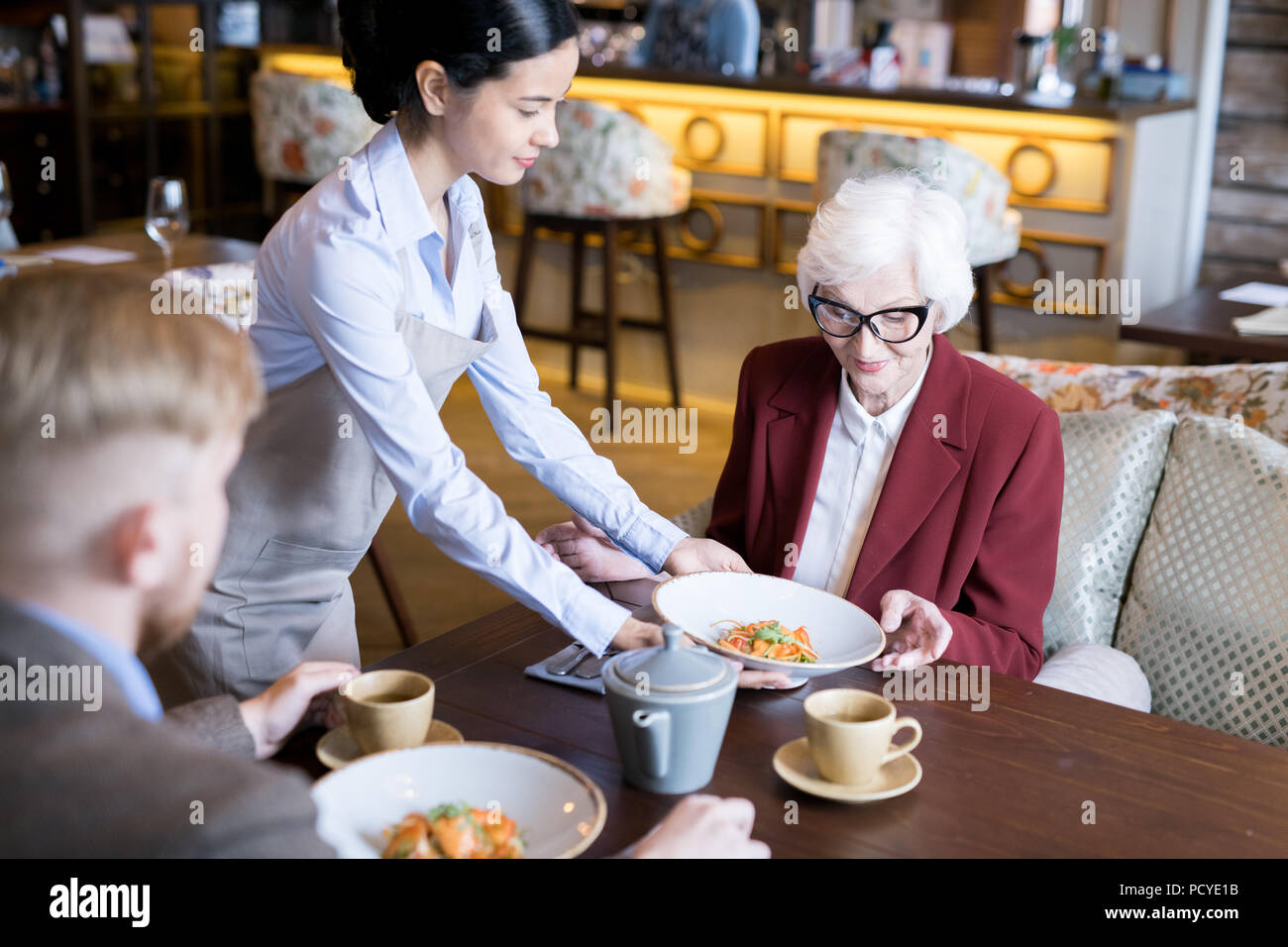 Having lunch at cafe Stock Photo - Alamy