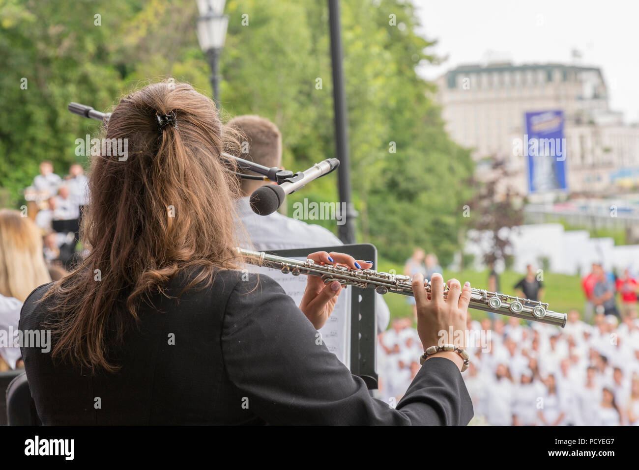 Young Woman Playing Flute Stock Photos & Young Woman Playing Flute ...