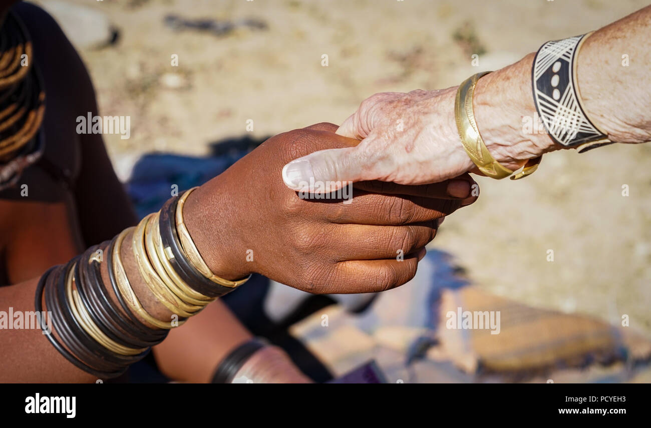 DAMARALAND NAMIBIA - MAY 21 2018; cross-cultural handshake of ...