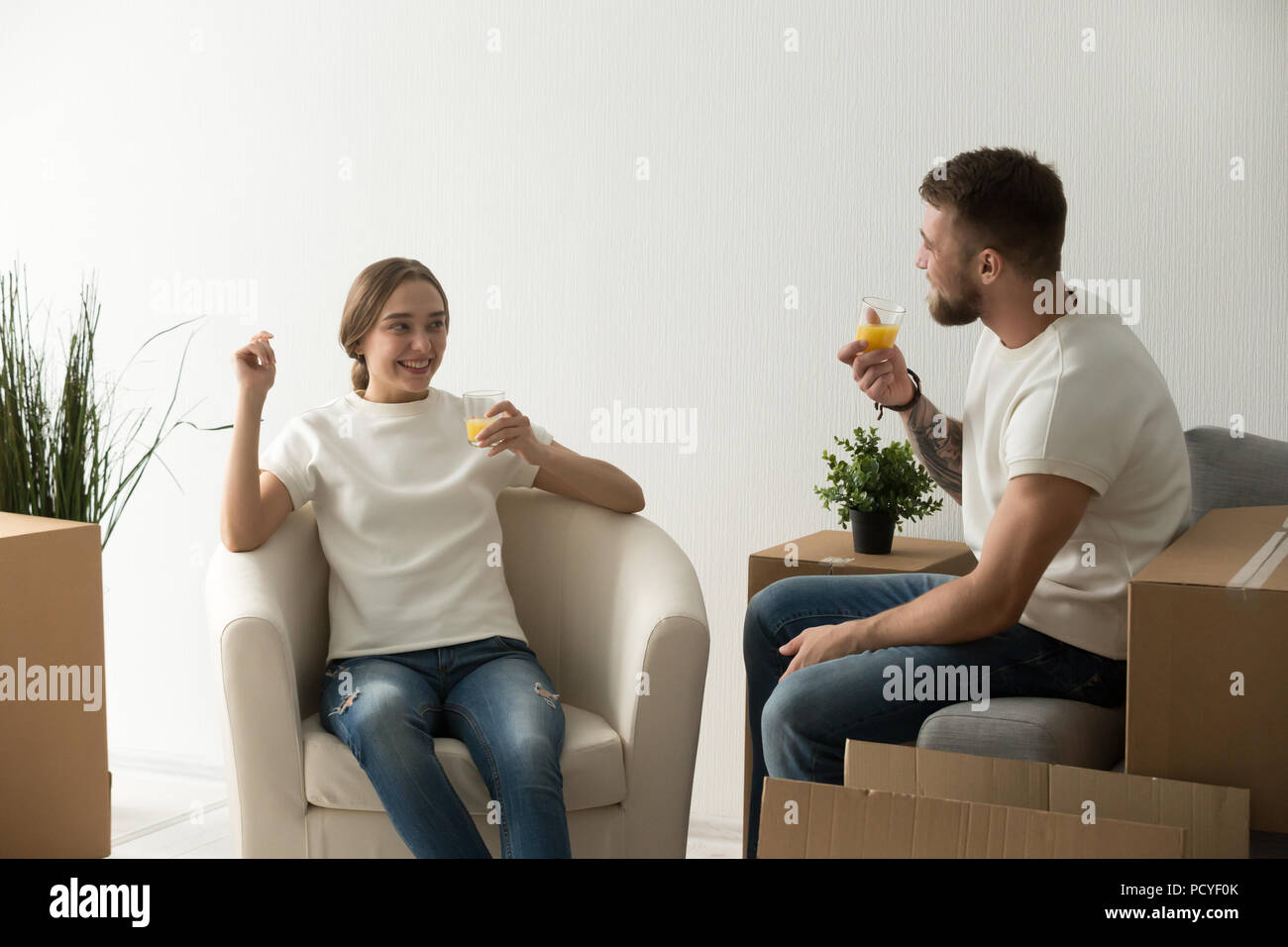Man relaxing laughing after unpacking hi-res stock photography and ...