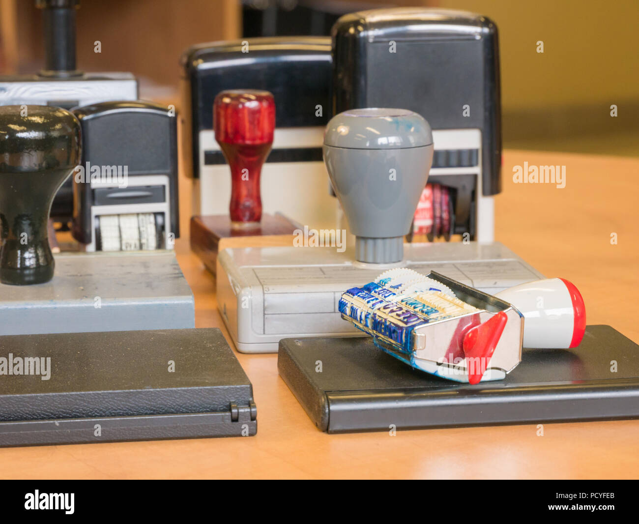Bunch of old office stamp on a desk Stock Photo - Alamy