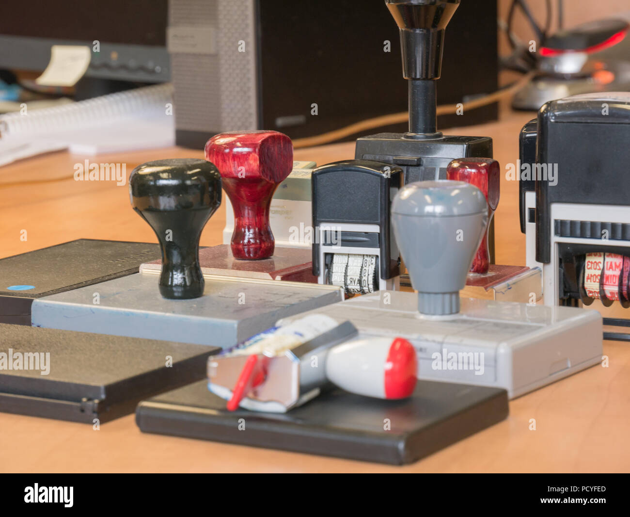 Bunch of old office stamp on a desk Stock Photo - Alamy