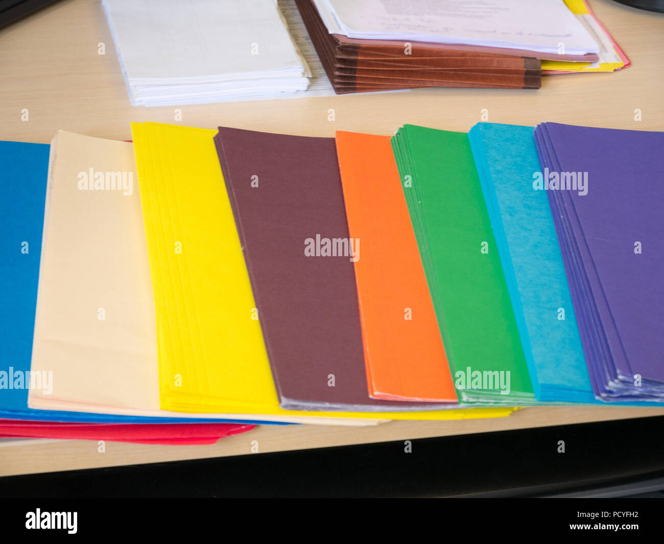 Close-up cropped image of pen and files with keyboard and spectacles on ...