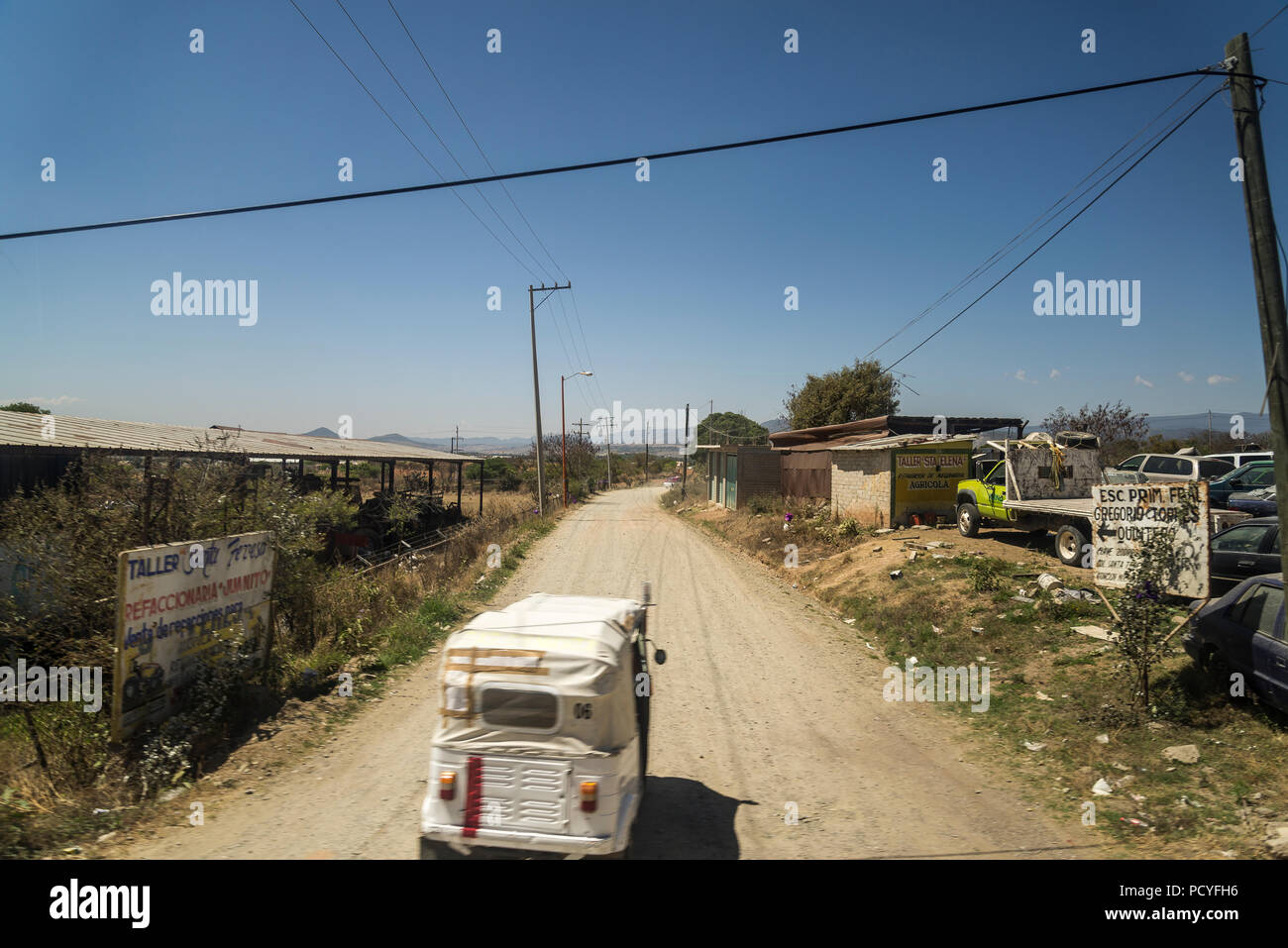 Mini van on dusty road, Oaxaca, Mexico Stock Photo - Alamy