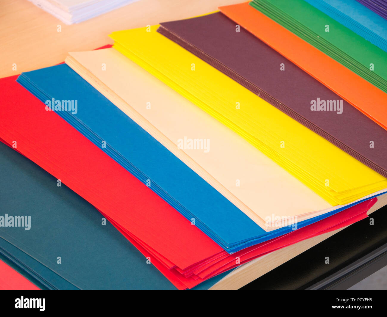 Close-up cropped image of pen and files with keyboard and spectacles on ...