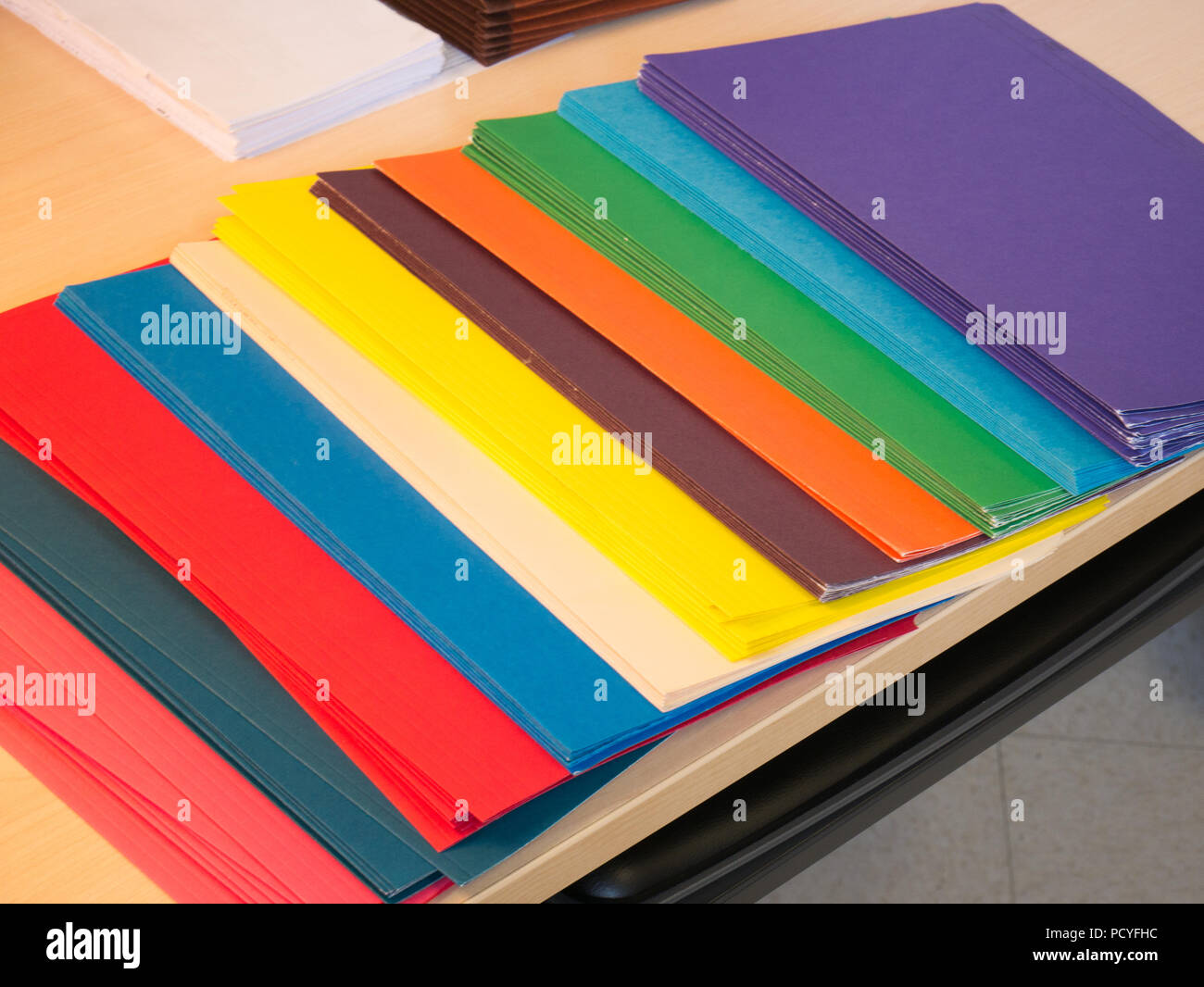 Close-up cropped image of pen and files with keyboard and spectacles on ...