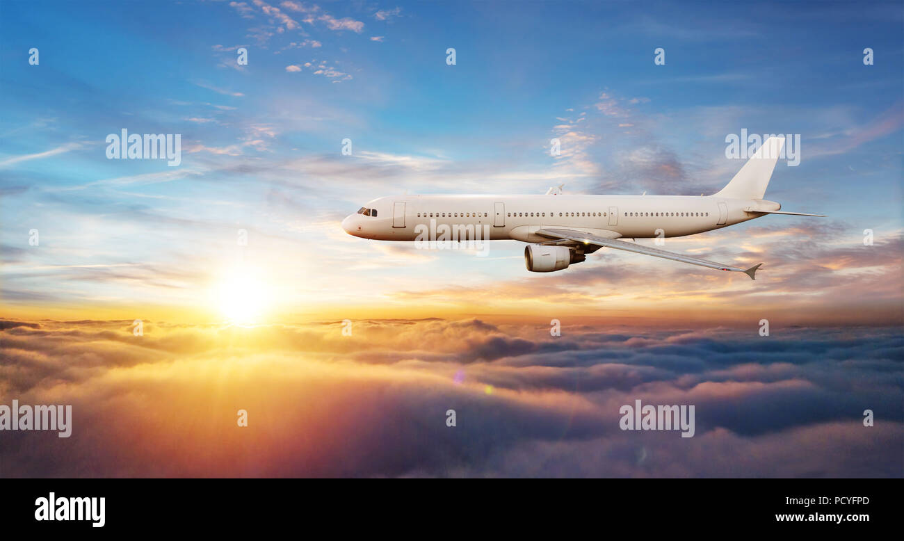 Detail of side view of commercial airplane flying above clouds ...